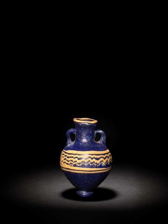 Bonhams : A Greek core-formed blue glass amphoriskos