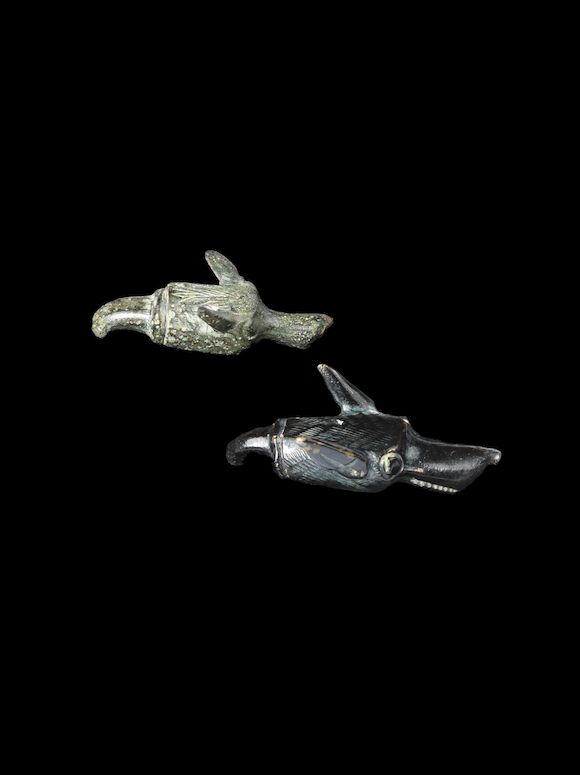 Bonhams : Two Achaemenid bronze wolf head finials