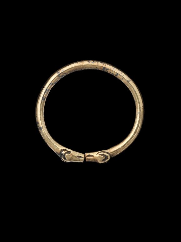 Bonhams : An Ancient Near Eastern gold penannular ring