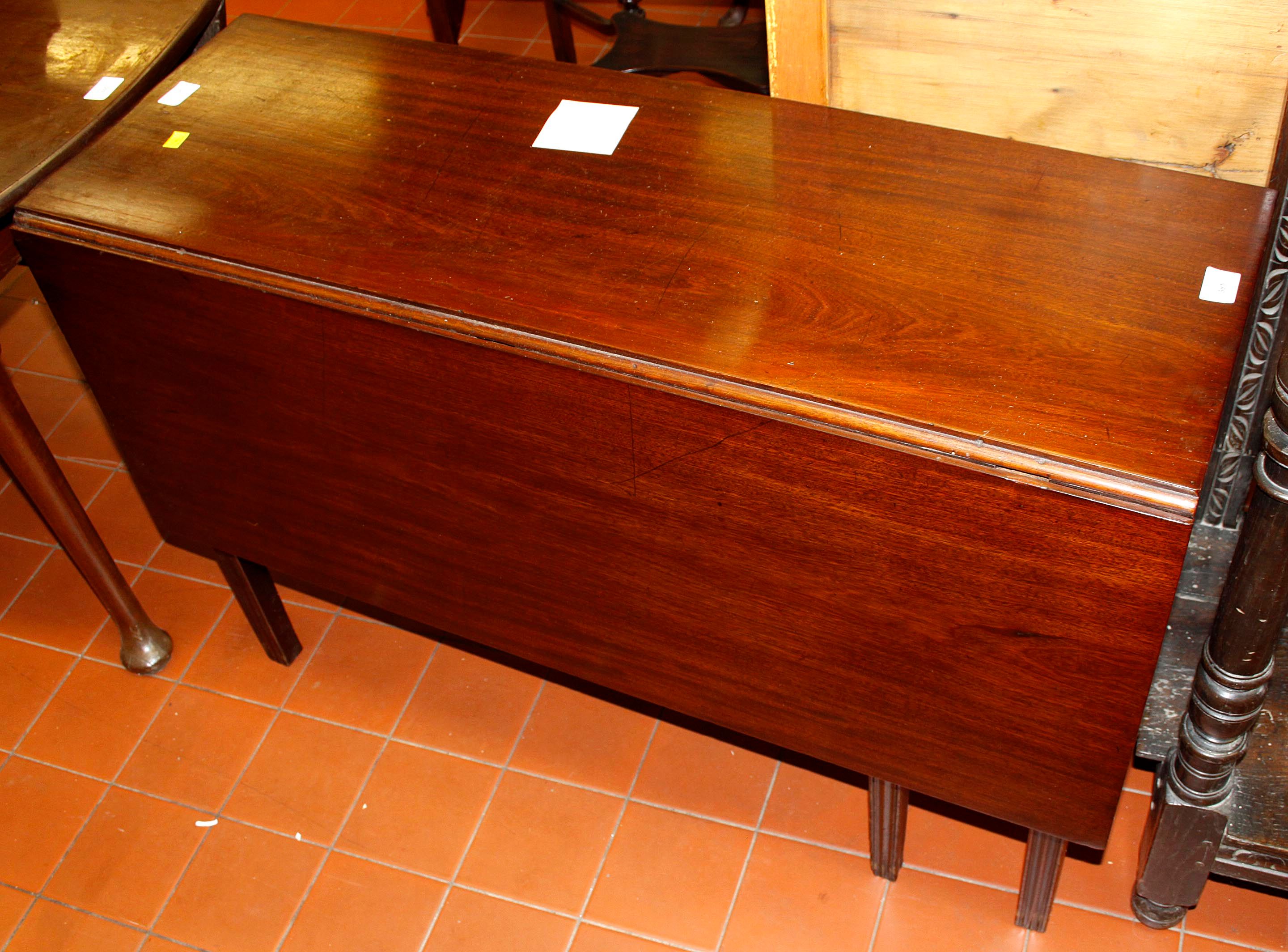 Bonhams : A George III mahogany drop-leaf table section,on plain ...