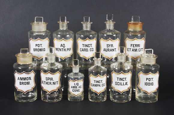 Bonhams : Twenty-one similar clear glass drug rounds