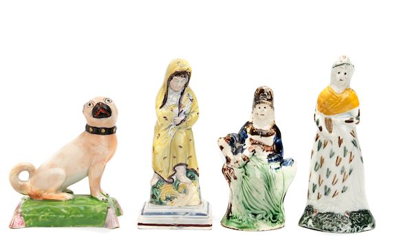 Bonhams : Two Pratt Ware candle snuffer figures of ladies, 19th century