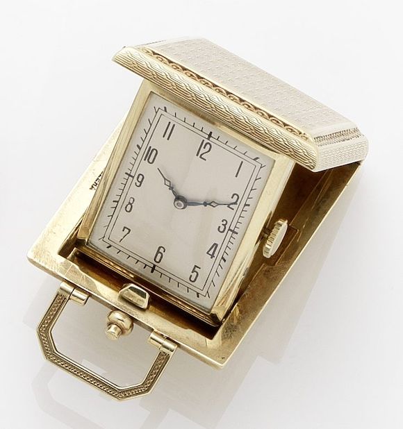 Bonhams : Swiss. A 14ct gold manual wind strut purse watch1930's