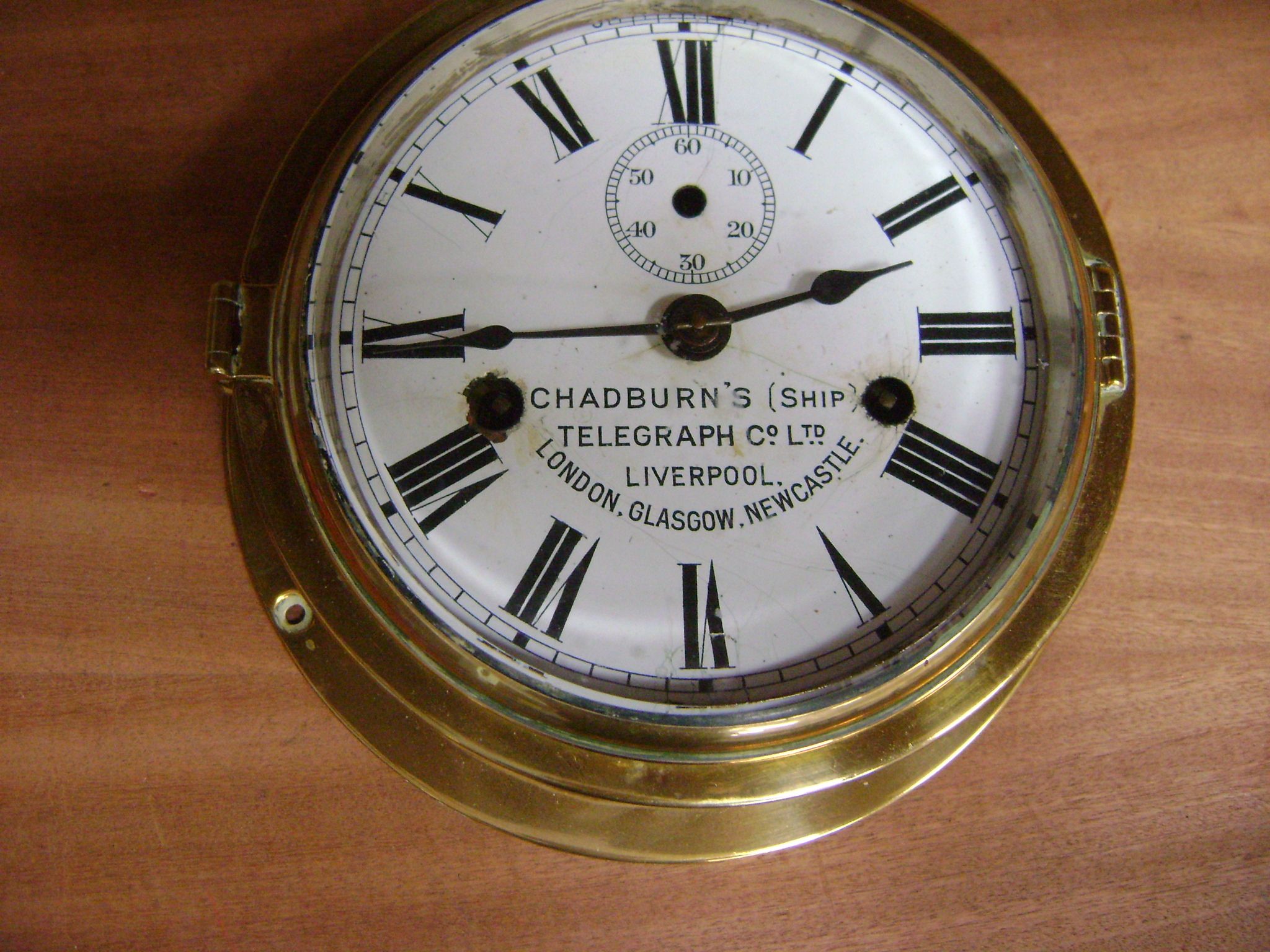 Bonhams : A brass ships wall mounted clock,the dial inscribed Chadburns ...