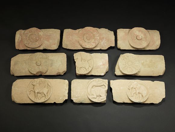 Bonhams : A group of nine Kushan style red sandstone Tiles India (9)