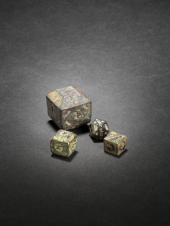 Bonhams : Four Mamluk bronze Dice Egypt or Syria, 13th/ 14th Century(4)