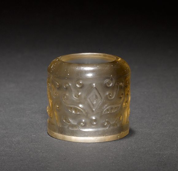 Bonhams : A glass or crystal archer's ring of typical form
