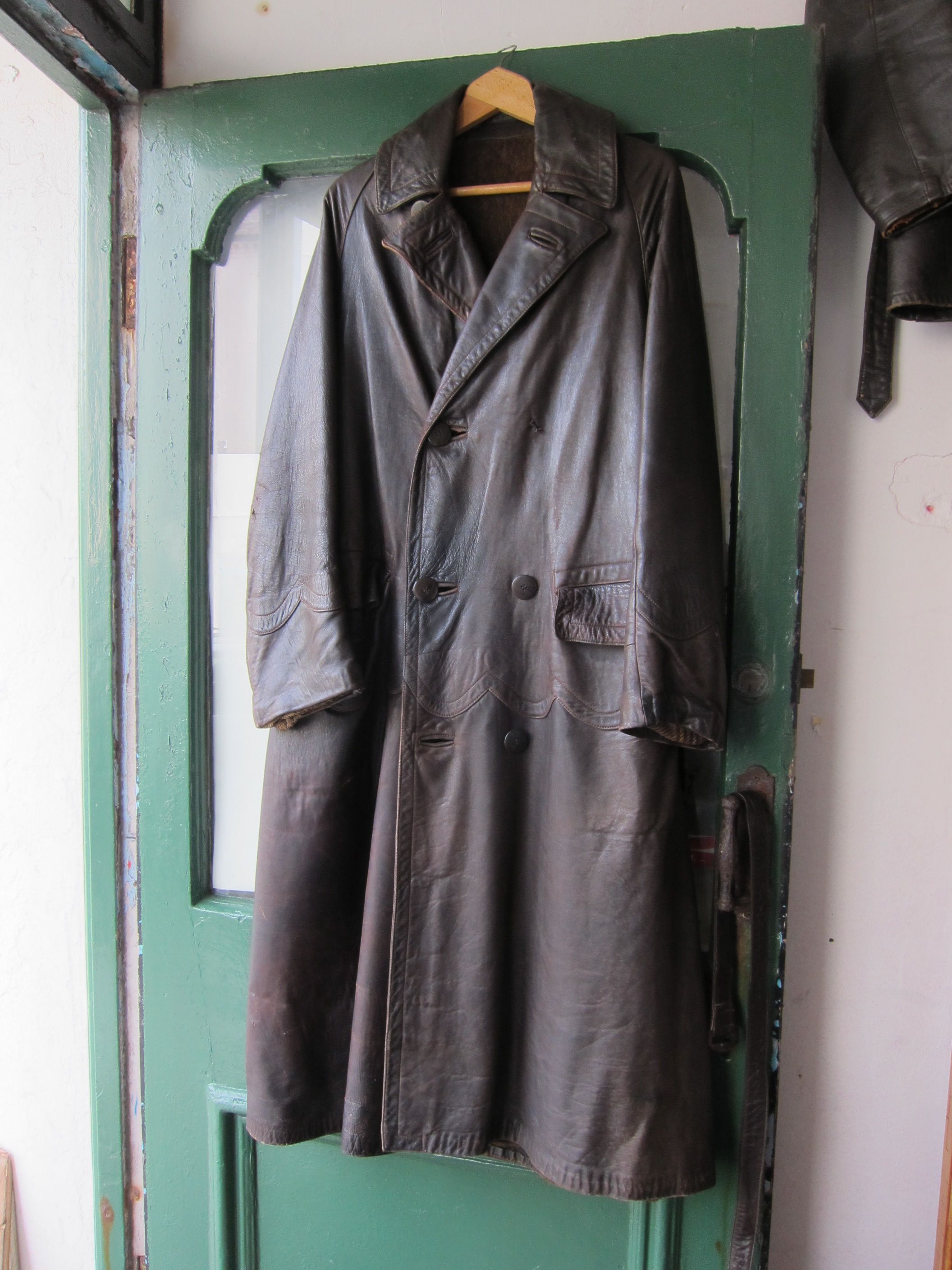 Bonhams Cars : A gents leather overcoat,