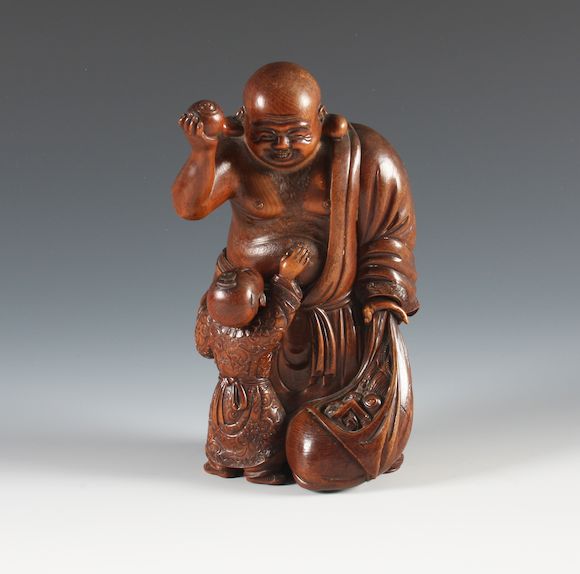 Bonhams : A Chinese carved wood figure of Ho Tai, 19th century