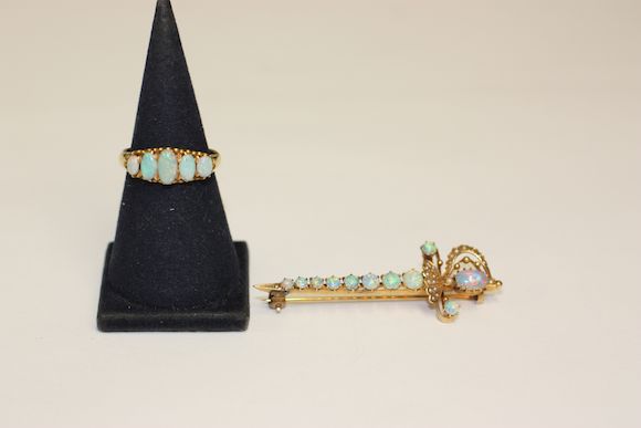 Bonhams : An opal and seed pearl set sword brooch,