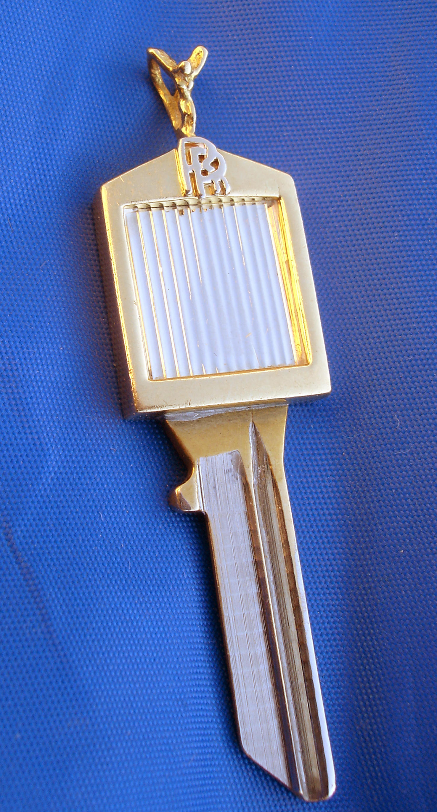 Bonhams Cars : An 18ct yellow & white gold Rolls-Royce key