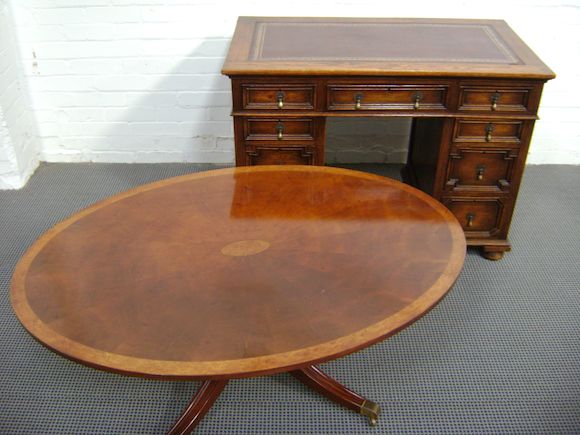 Bonhams : An oak pedestal desk,the nine drawers outlined with bolection ...