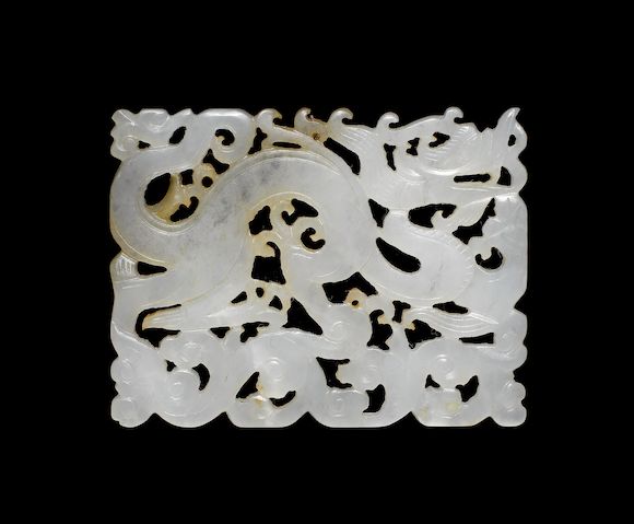 Bonhams : A white or pale celadon jade plaque of reticulated form ...