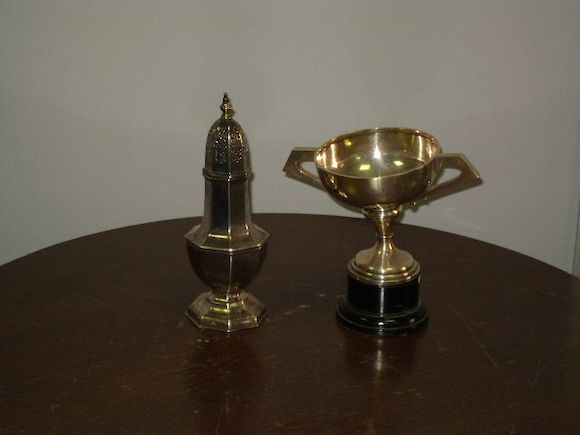 Bonhams : A silver sugar caster, London 1912 and a trophy cup.