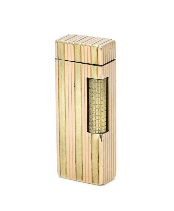 Bonhams : DUNHILL: A twin colour 18ct gold 'Rollalite' lighter, by ...