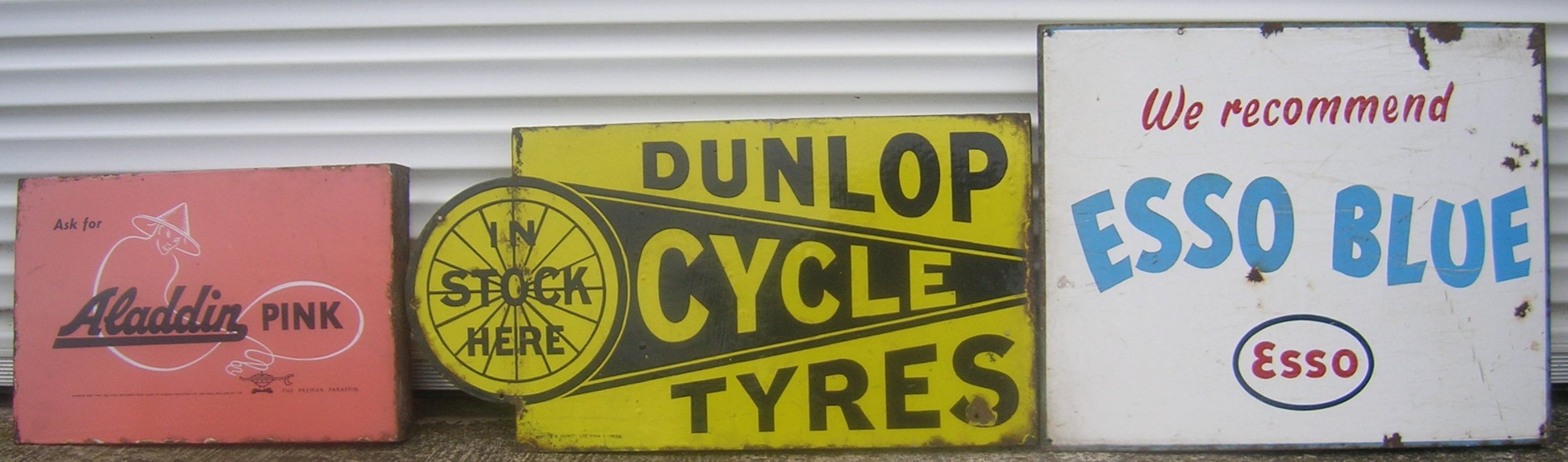 Bonhams Cars : Three enamel advertising signs,