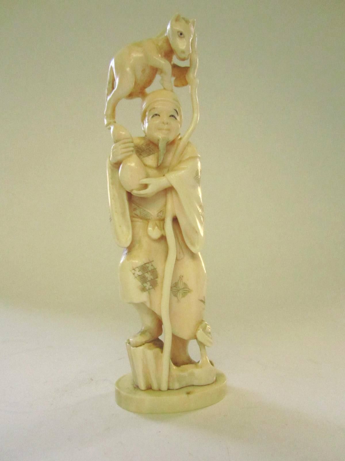 A bone figure group - auctions & price archive