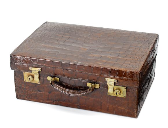 Bonhams : An early 20th century 19 inch brown crocodile leather case, with gilt stamp C J ...