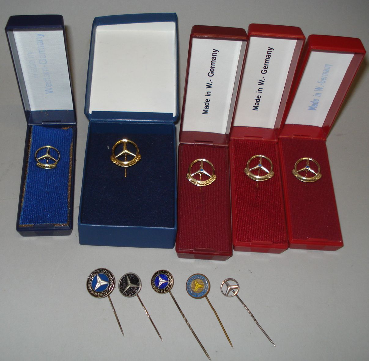Bonhams Cars : A rare set of Mercedes-Benz distance lapel pins,