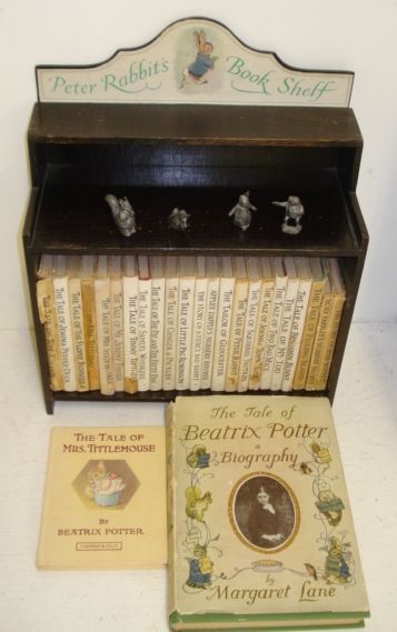Bonhams : A Peter Rabbit's book shelf, in dark stained oak, together ...