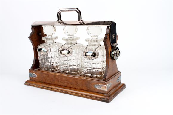 Bonhams : A circa 1900 oak and electroplate mounted tantalus