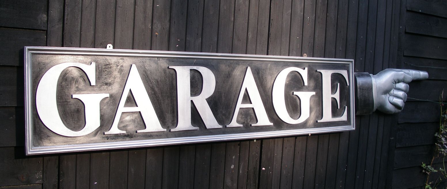 Bonhams Cars : A hand-painted motoring themed directional finger sign,