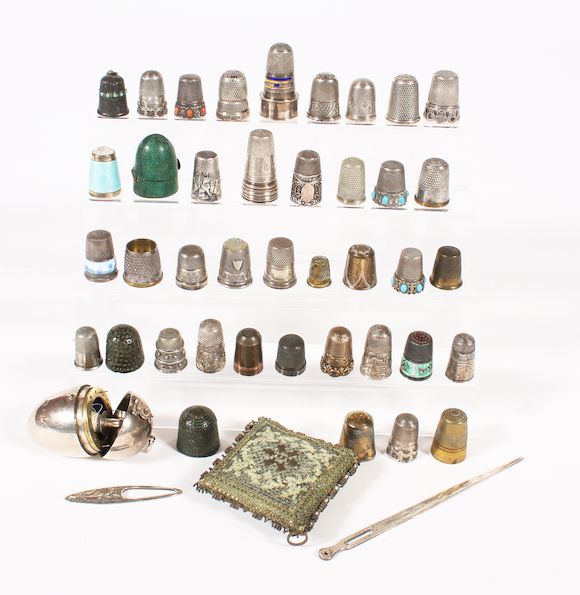 Bonhams : A silver egg shaped etui and a group of thimbles, most 19th ...