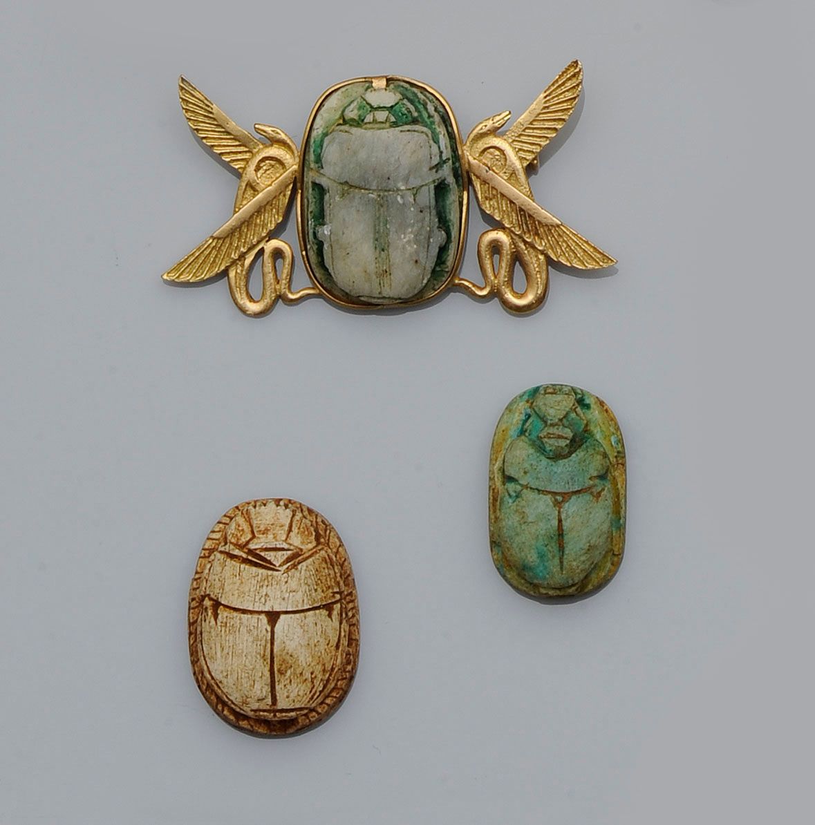 Bonhams : A scarab brooch and two loose scarabs