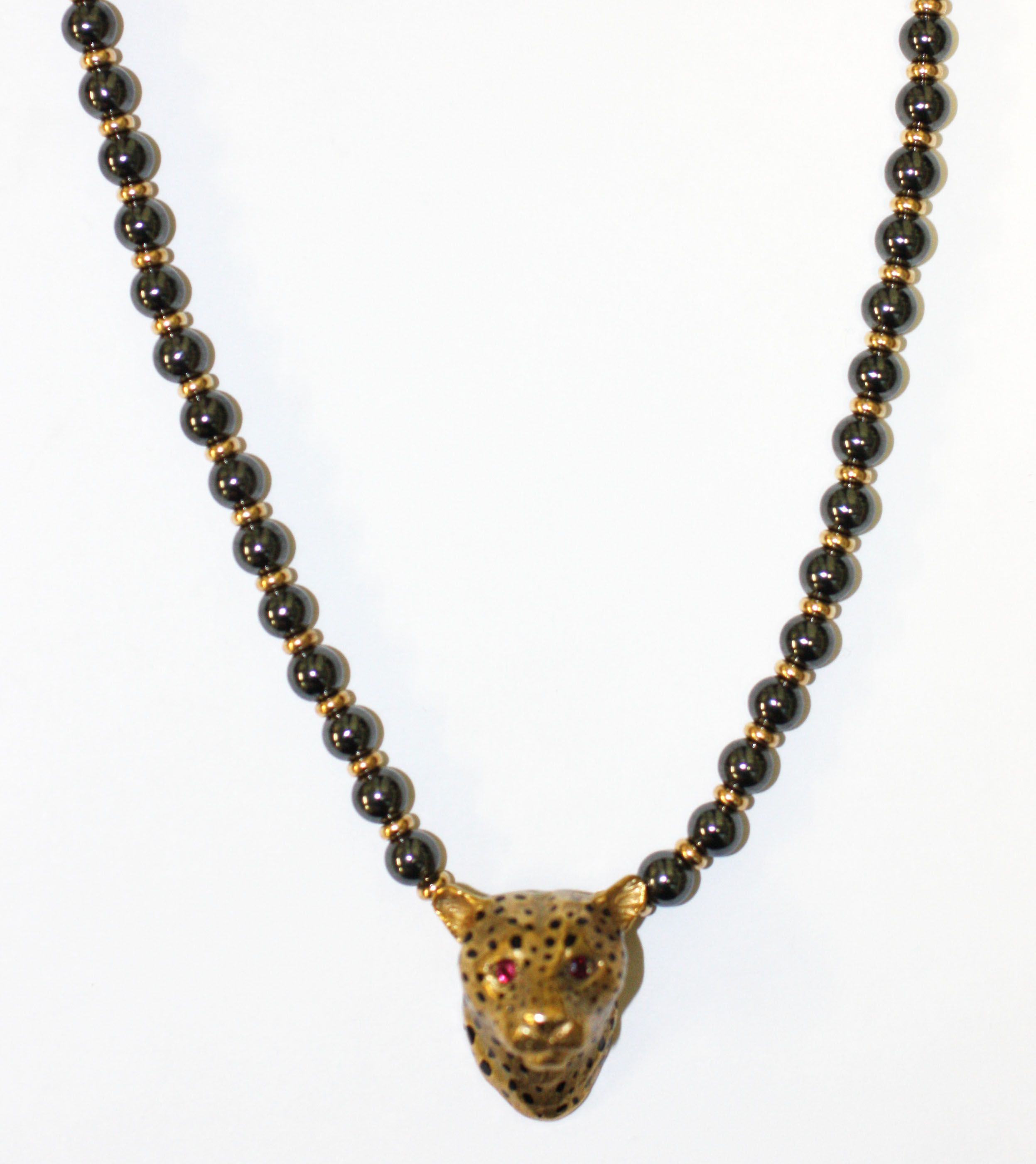 Bonhams : Harriet Glen A 9ct gold leopard head pendant on hematite bead ...