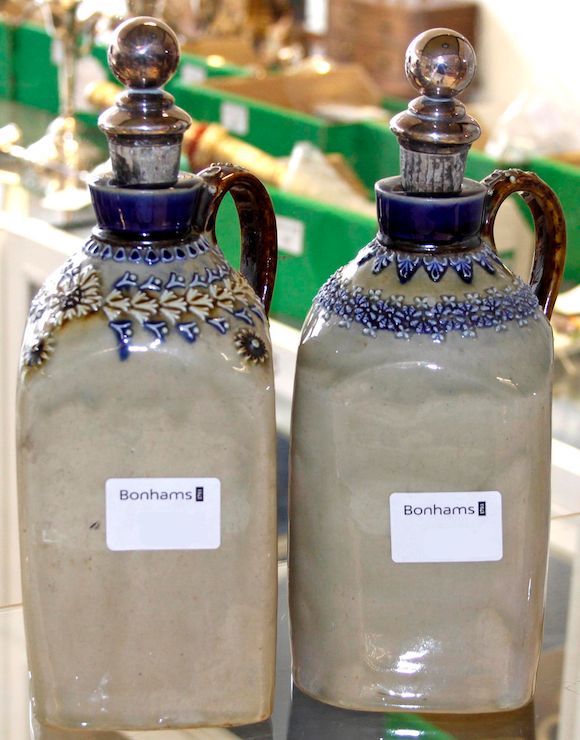 Bonhams : Two Doulton Lambeth stoneware square shaped flasks