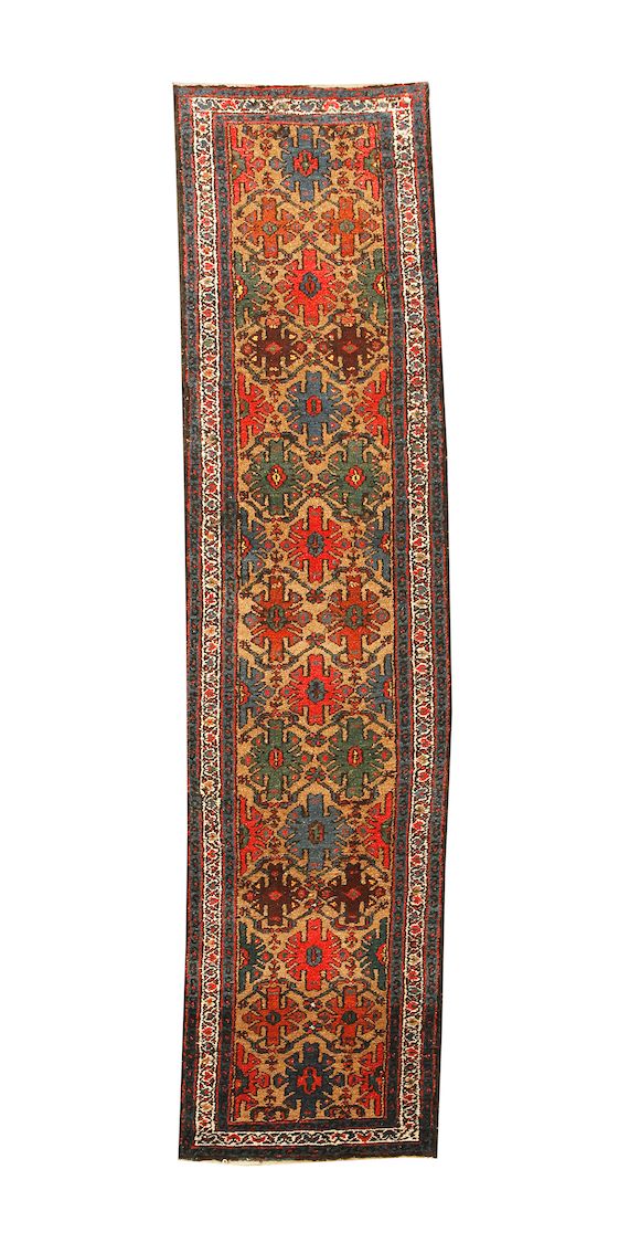 Bonhams : A North West Persian runner, 283cm x 70cm
