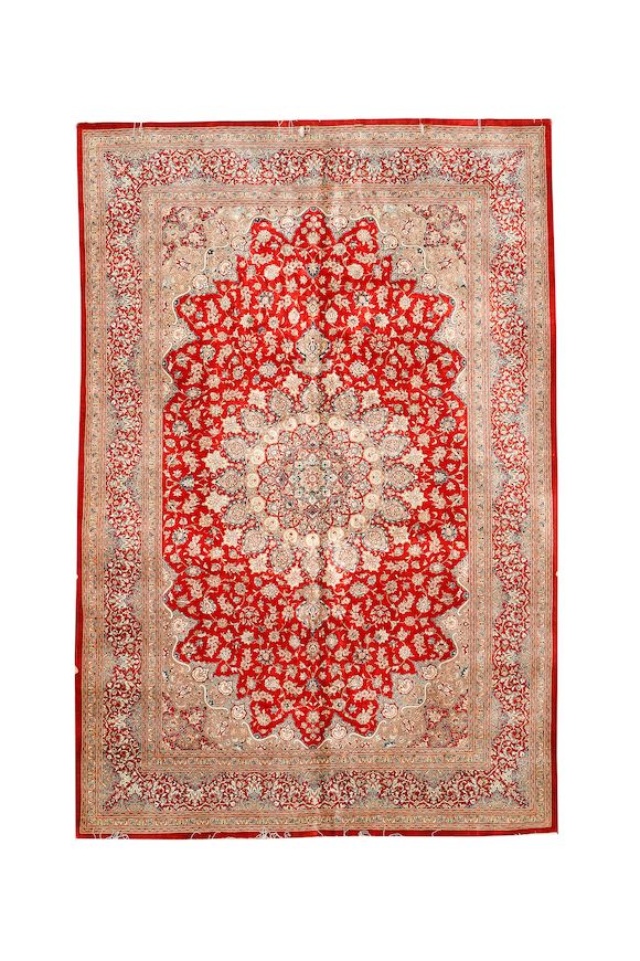 Bonhams : A silk Ghom carpet, Central Persia, 300cm x 196cm