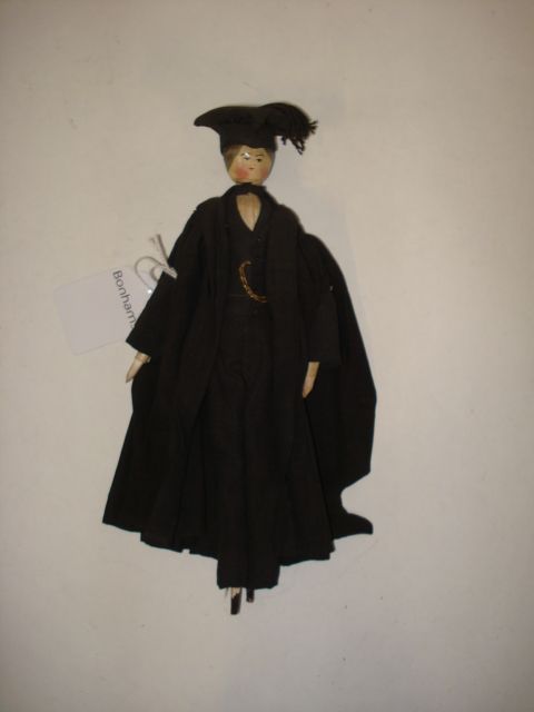 Bonhams : Painted wooden peg doll teacher