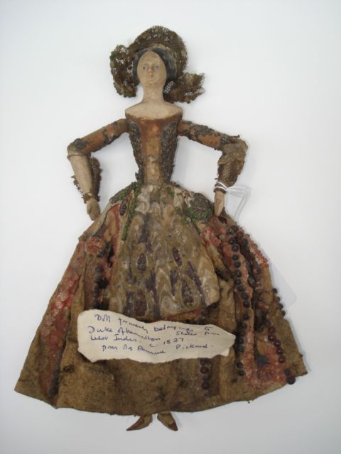 Bonhams : Early painted wooden shell doll