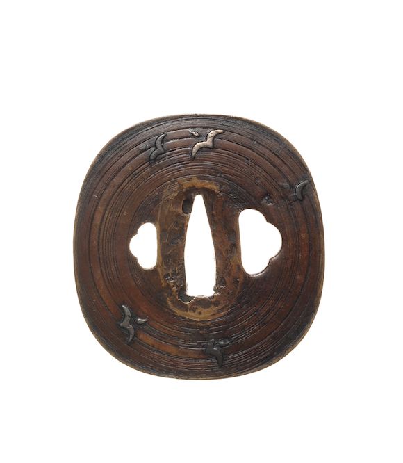 Bonhams : A copper tsuba Attributed to Hirata Hikozo I, 17th century
