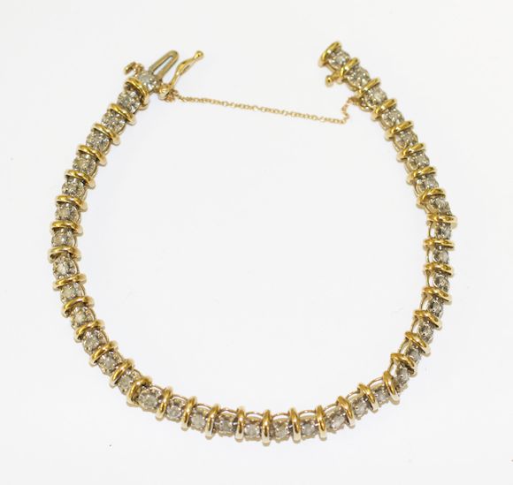 Bonhams : A diamond set line bracelet,