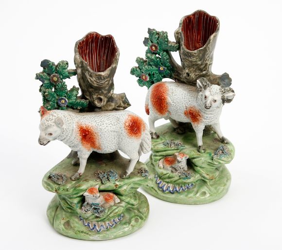 Bonhams : A pair of Staffordshire Walton sheep spill vases, early 19th ...