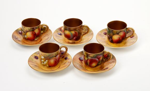Bonhams : A collection of Royal Worcester fruit painted matched coffee cans and saucers, painted ...