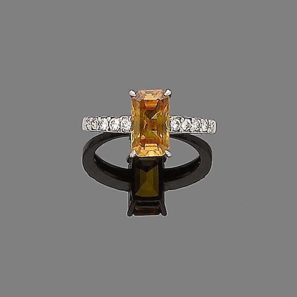 Bonhams : An orange sapphire and diamond ring