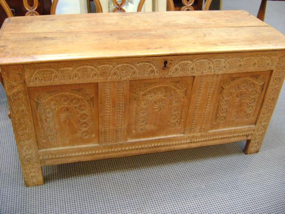 Bonhams : A 17th Century oak coffer,the three panel front carved with ...
