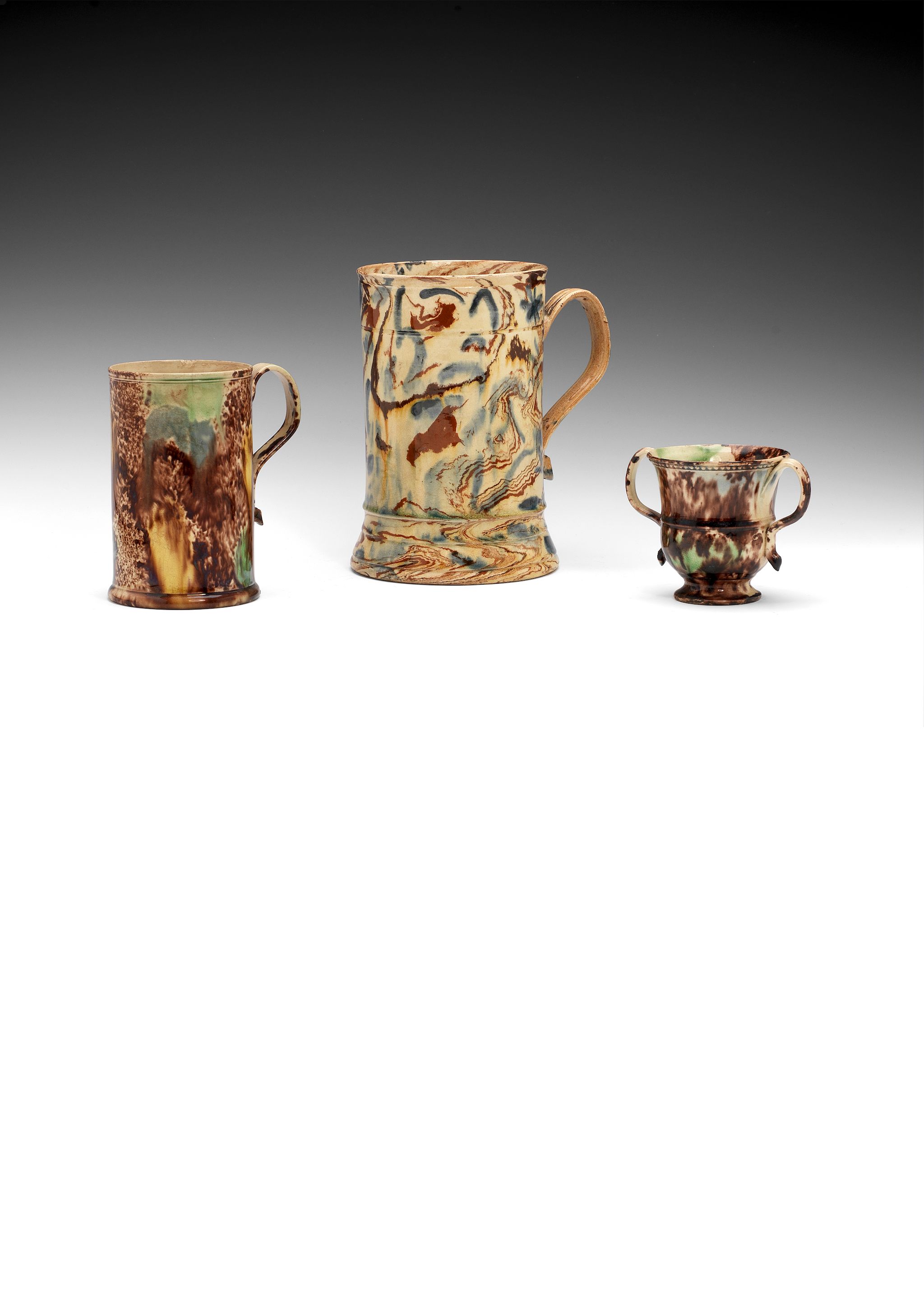 Bonhams : A large Staffordshire agateware mug, circa 1755