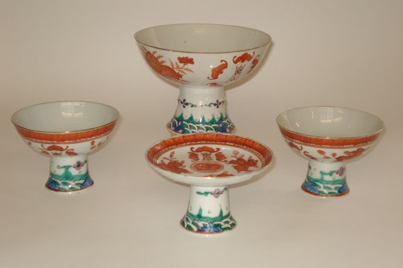 Bonhams : Three iron red stem bowls and a comport