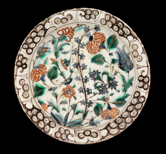 Bonhams : An Iznik 'Storm in a teacup' design pottery Dish Turkey, 17th ...