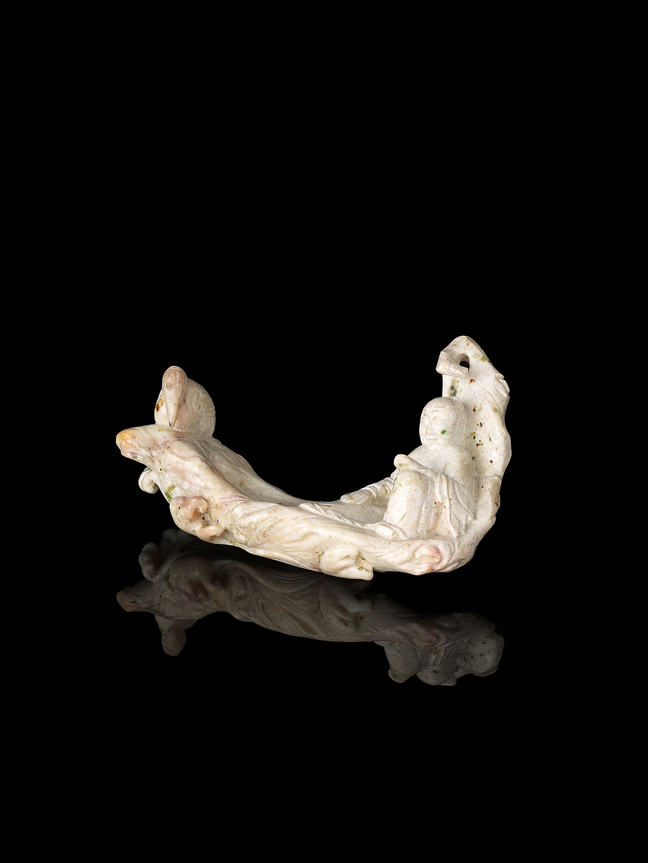 Bonhams : A rare 'burnt' jade carving of a tree-trunk raft 18th century