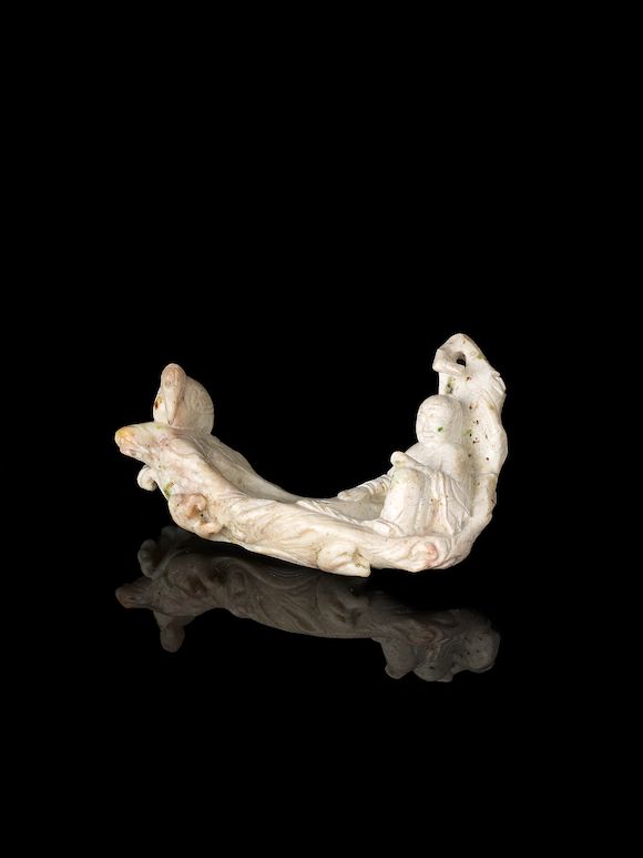 Bonhams : A rare 'burnt' jade carving of a tree-trunk raft 18th century