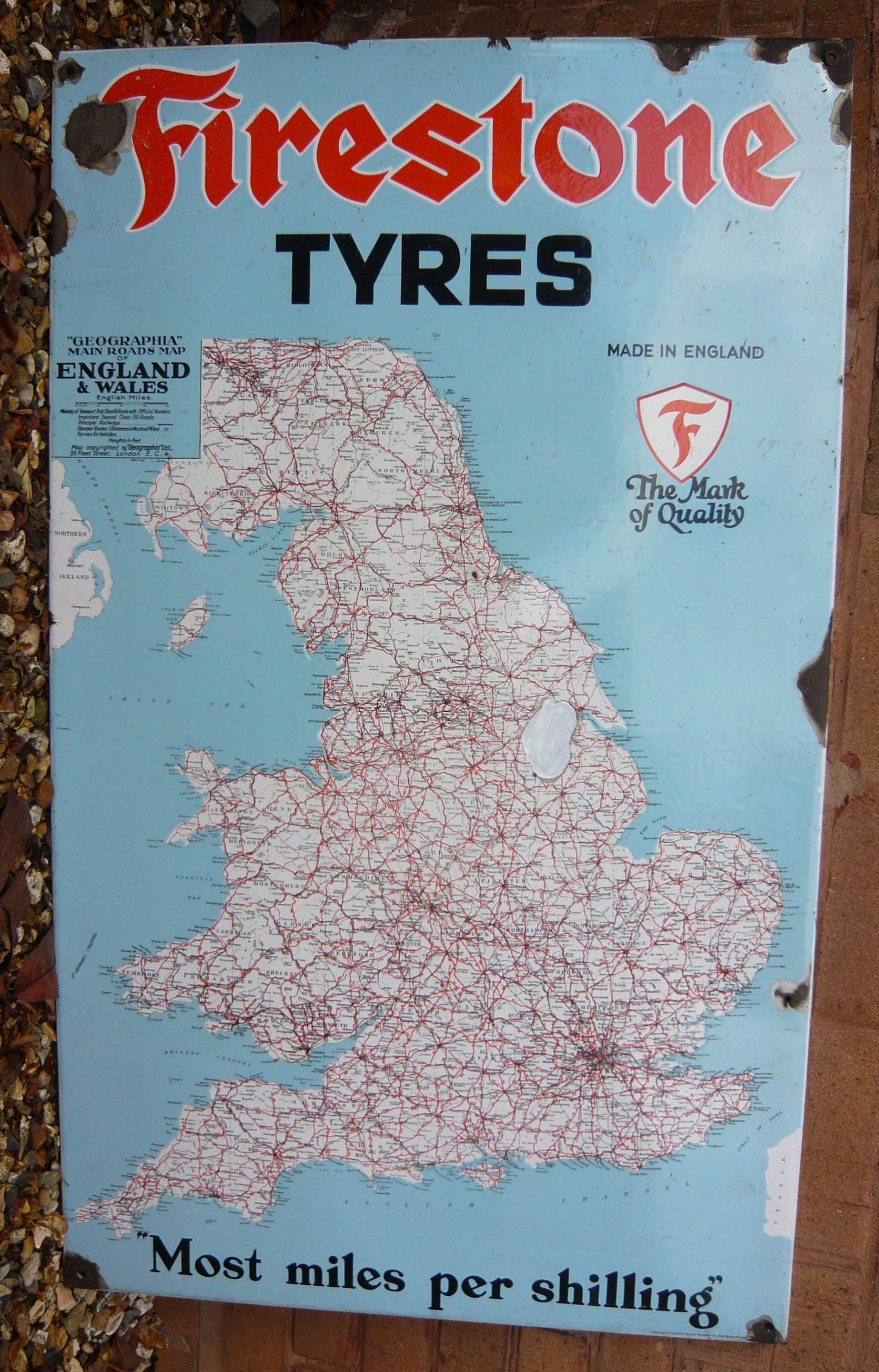 Bonhams Cars : A Firestone Tyres enamel map sign,