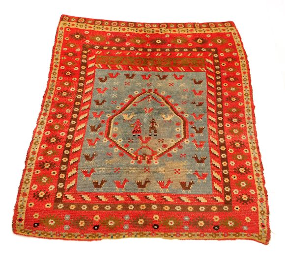 Bonhams : A Ria rug 176cm x 142cm.
