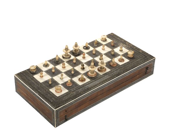 Bonhams : An Islamic bone chess set, Northern India, 19th century,