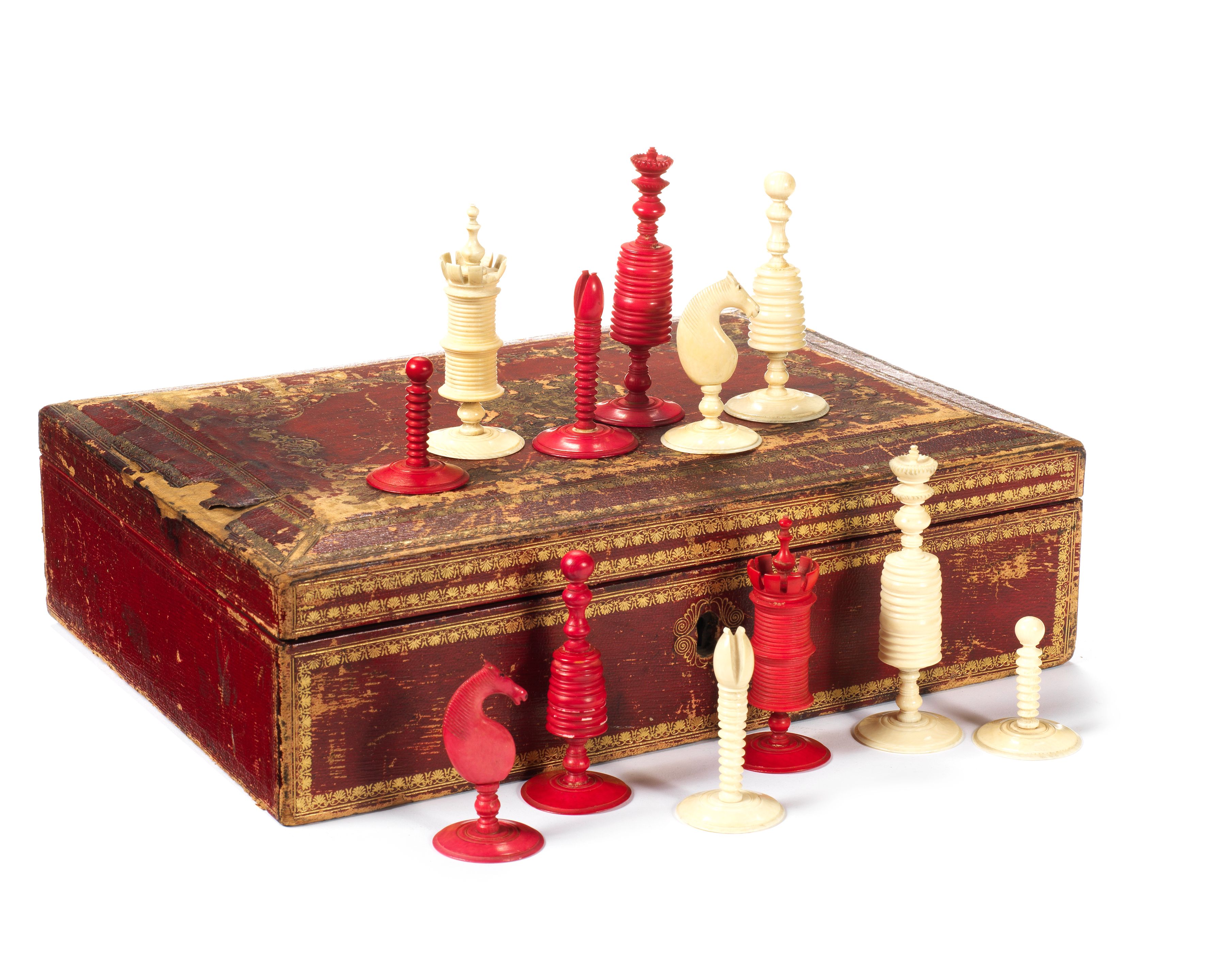 Bonhams : 19th century ivory and red stained chess set, in red leather box