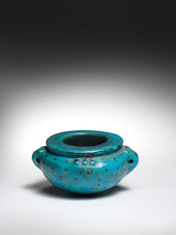 Bonhams : An Egyptian turquoise glazed composition jar